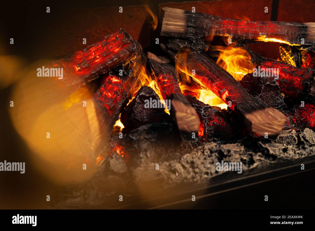 Close up of a fireplace with burning wood logs inside Stock Photo - Alamy