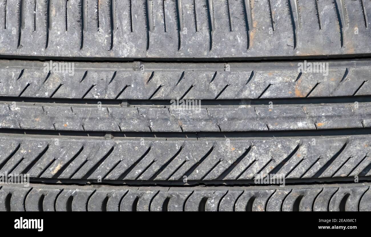 Rubber grooves of an old car tire form a nice pattern, that lends ...