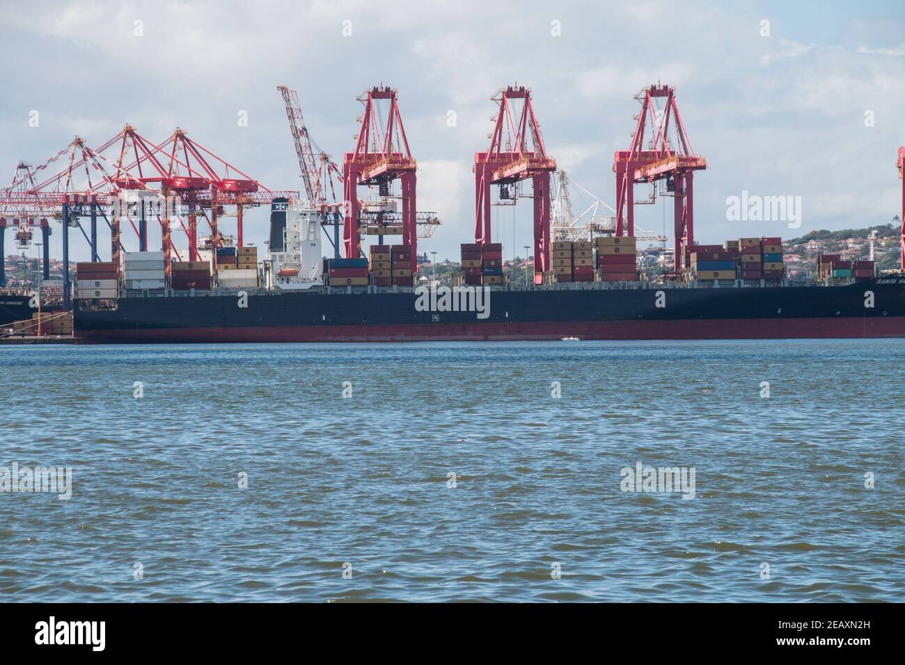 Container ship moored in harbour loading cargo Stock Photo - Alamy