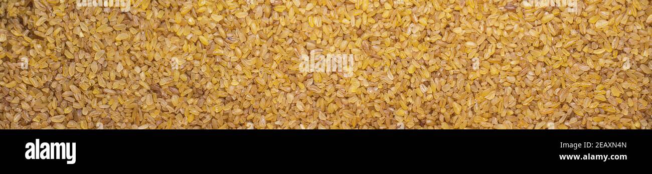 Close-up of bulgur cereal seeds. Panoramic background of bulgur cereals ...