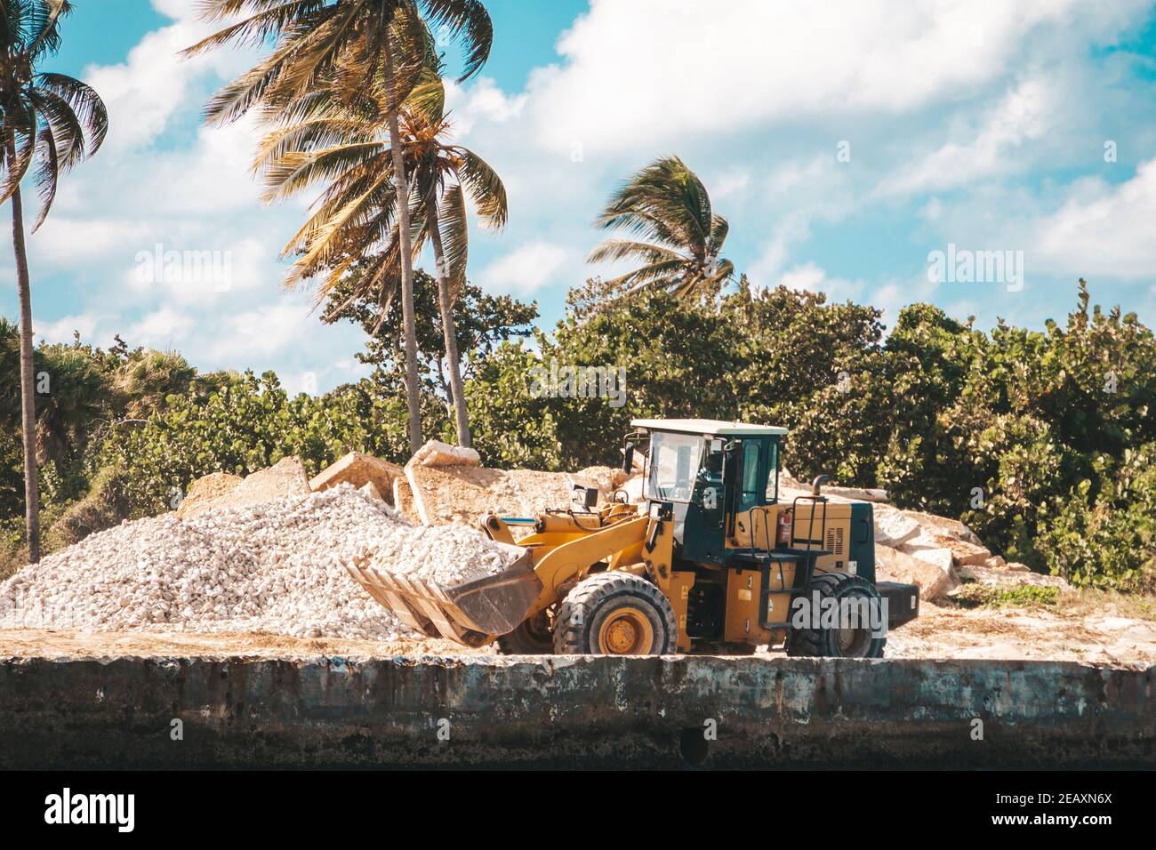 Wheel loader Excavator unloading sand with stone moving works at ...