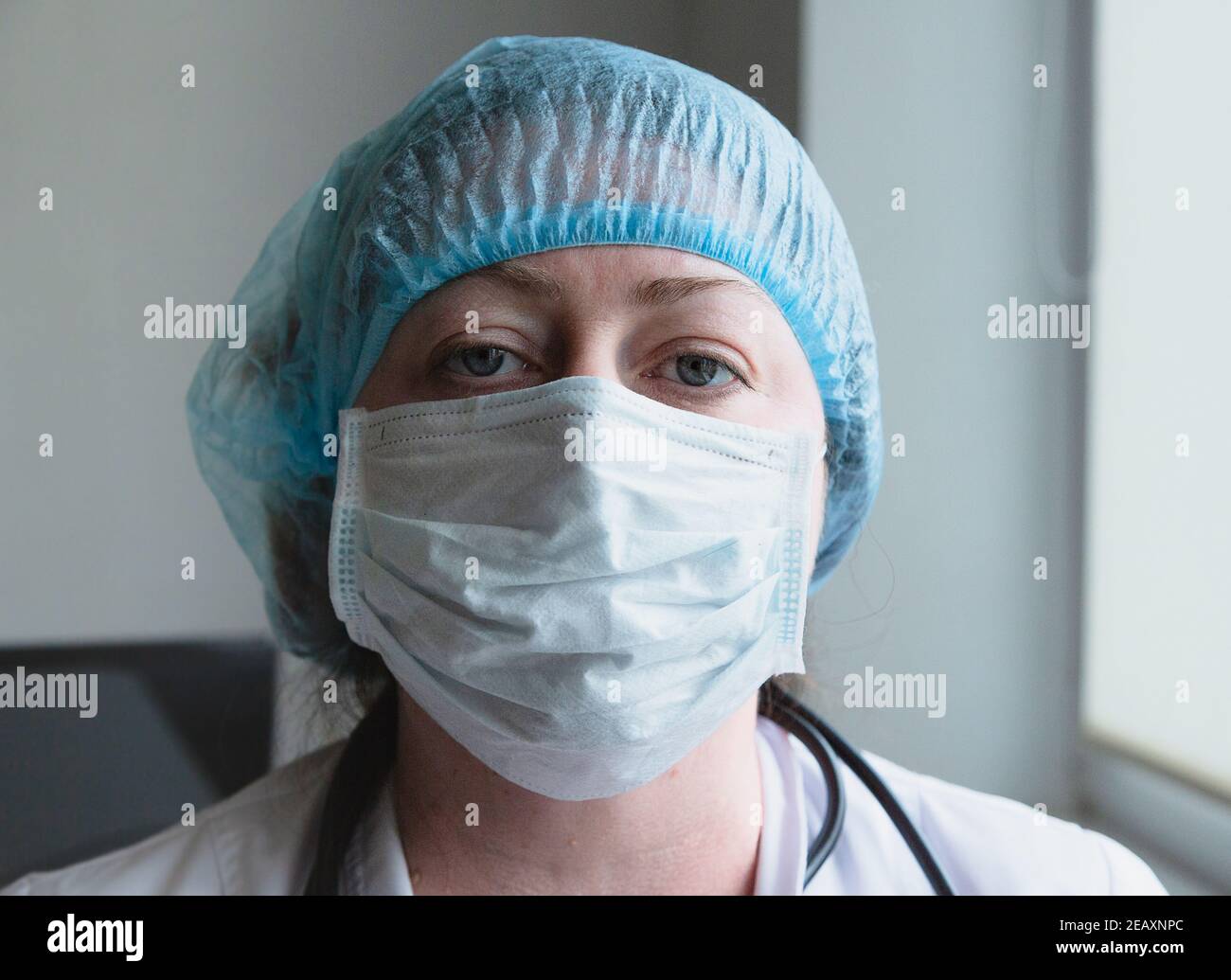 A portrait of a female doctor. Medical equipment protective medical ...