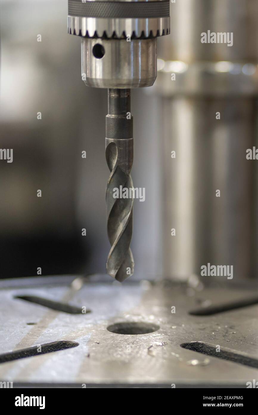 Mechanical Drill bit in factory to drill through steel Stock Photo - Alamy