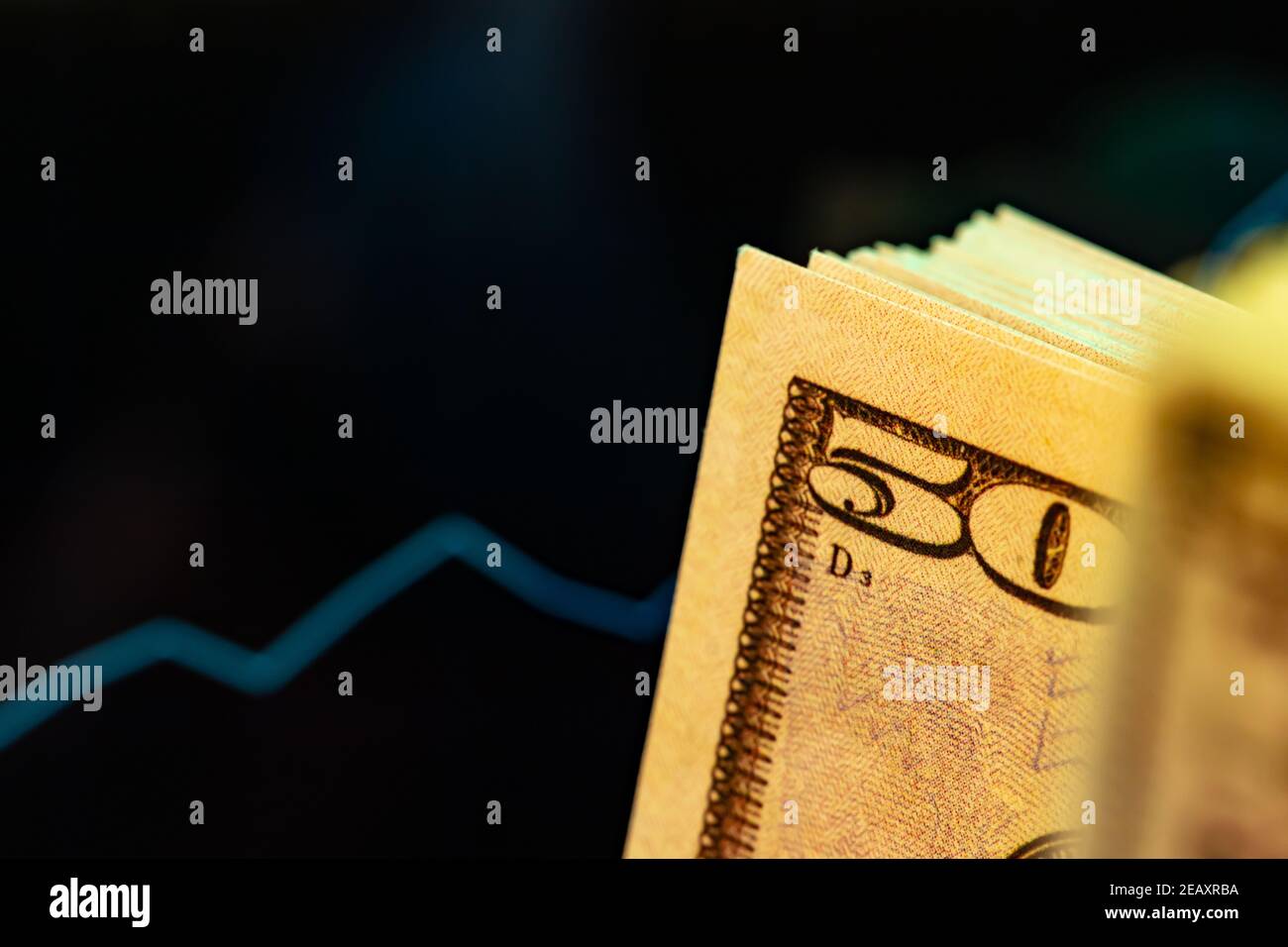 American dollar banknotes and graph on black background Stock Photo - Alamy