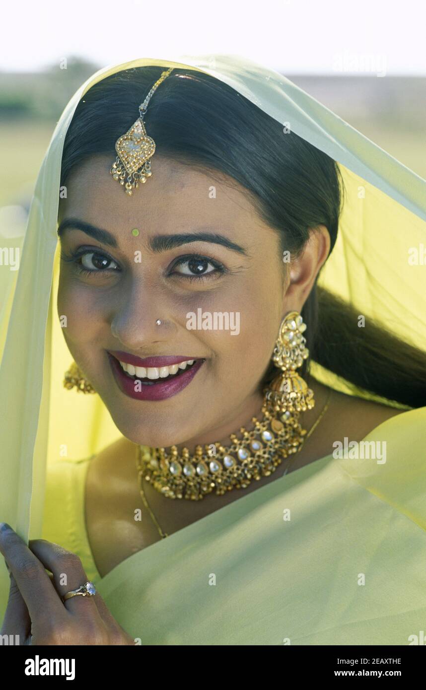 Asia, India, Mumbai, model released portrait of a beautiful smiling ...