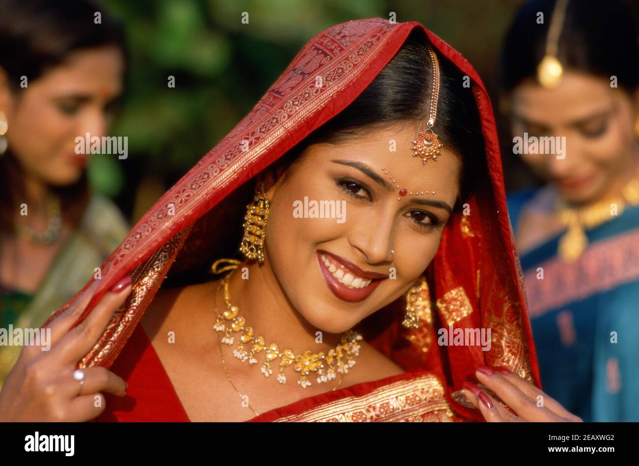 Asia, India, Mumbai, model released portrait of a beautiful smiling ...