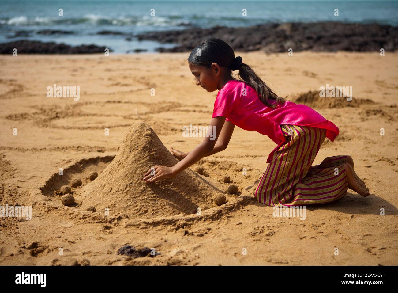 Child building in sand hi-res stock photography and images - Alamy