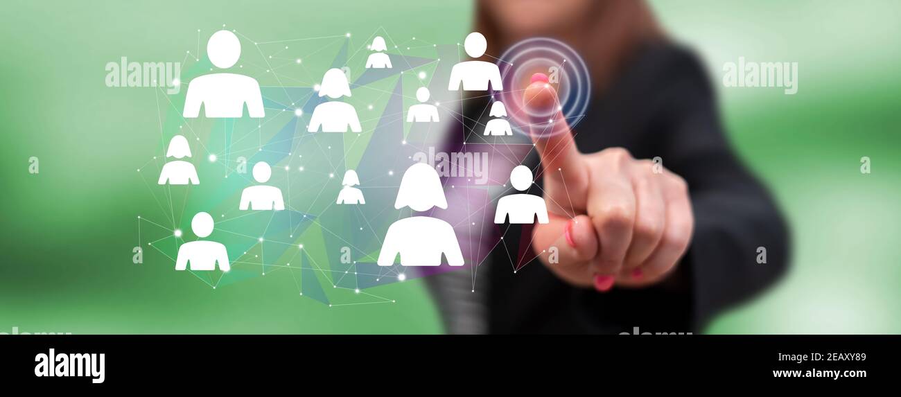 Woman touching a social network concept on a touch screen with her ...