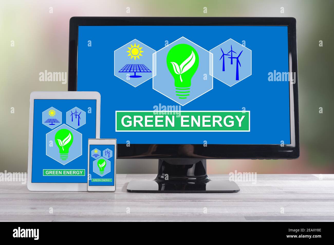 Green energy concept shown on different information technology devices ...