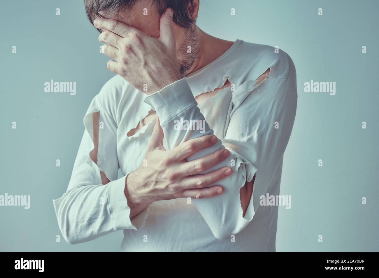 Male victim of domestic violence and abuse, conceptual image of adult ...