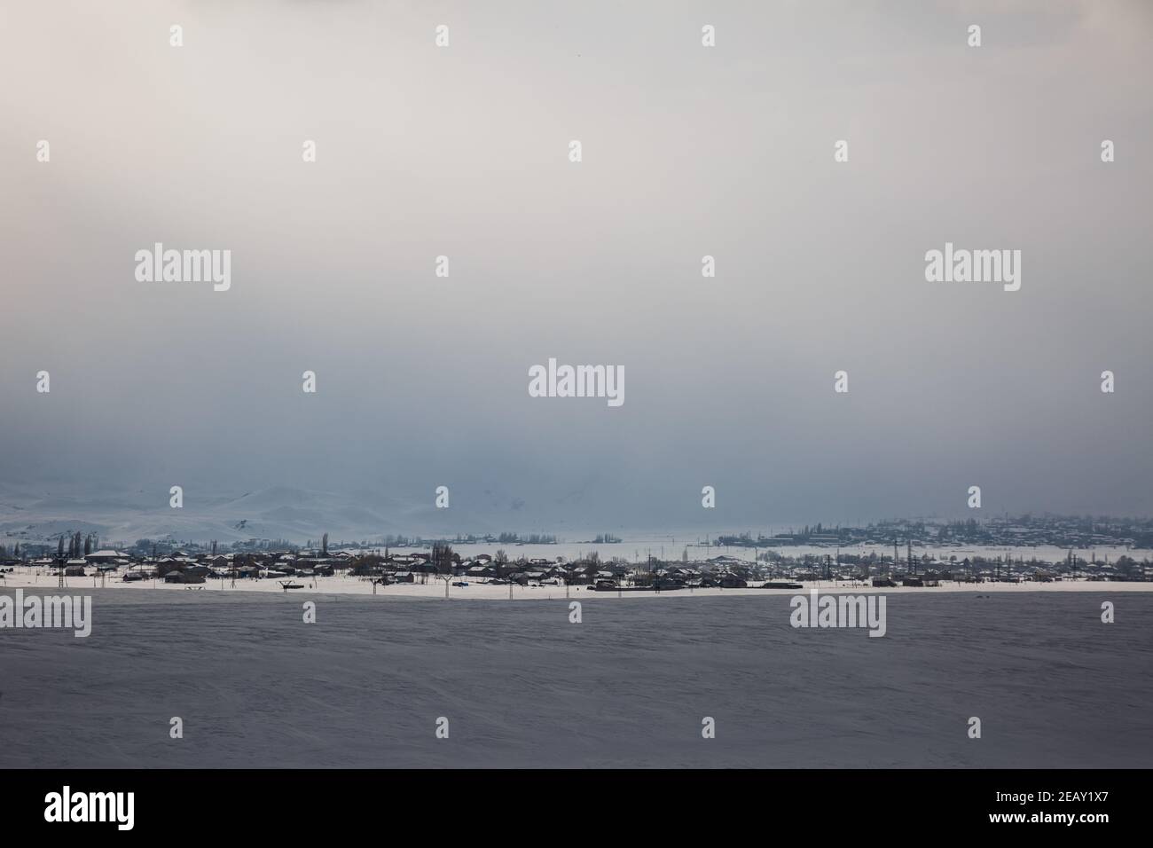 Less populated tiny village in snowy winter Stock Photo - Alamy