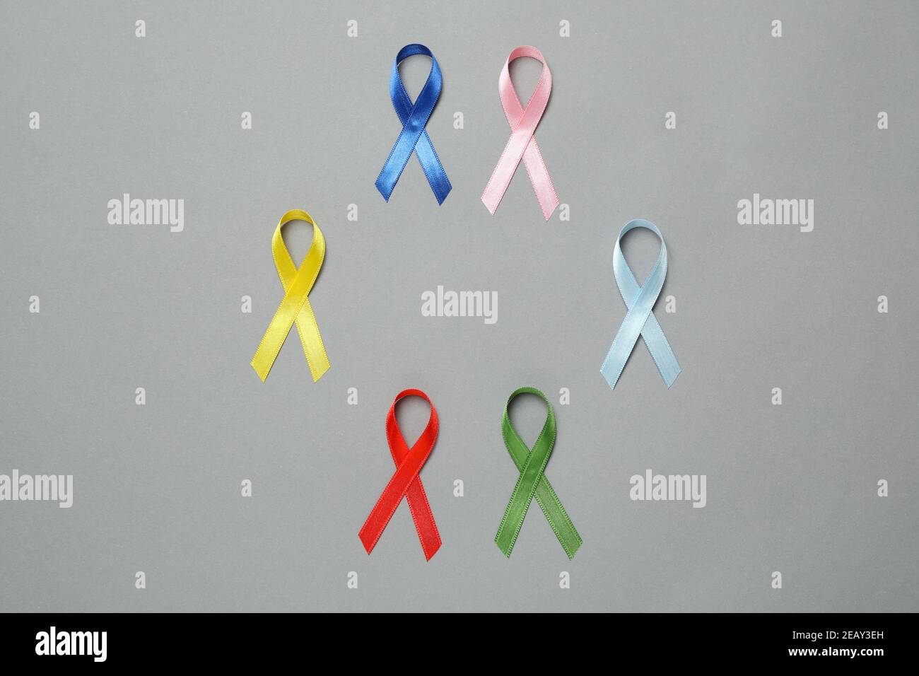 Different multi colored awareness ribbons on gray background Stock ...