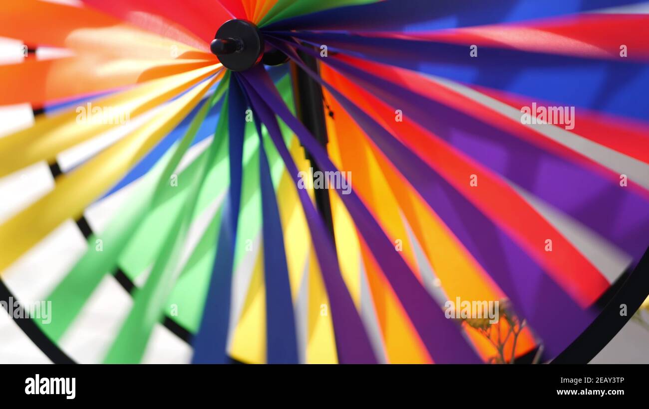 Colorful pinwheel spinning, weather wind vane, garden decoration in USA ...