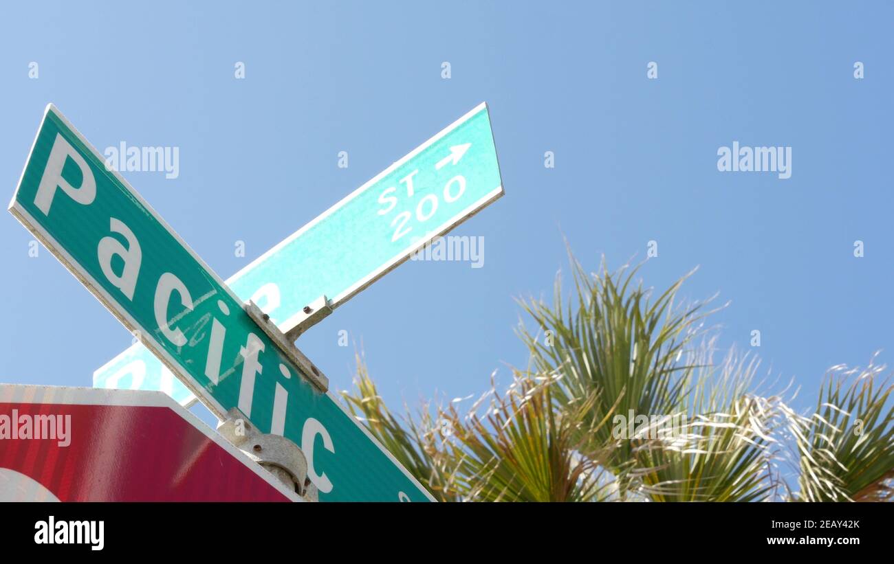 Pacific street road sign on crossroad, route 101 tourist destination ...