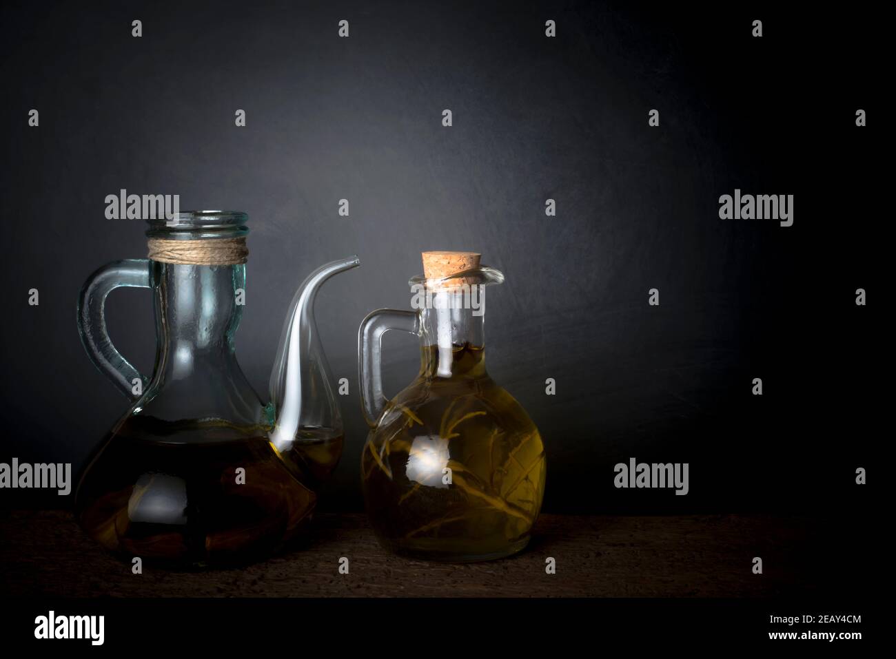 Extra virgin olive oil. Two oil pitcher with extra virgin olive oil ...