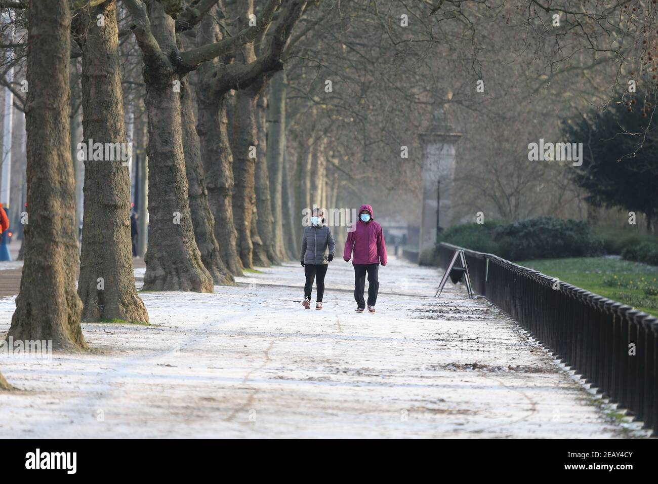 London, England, UK. 11th Feb, 2021. People walk on the frozen ground ...