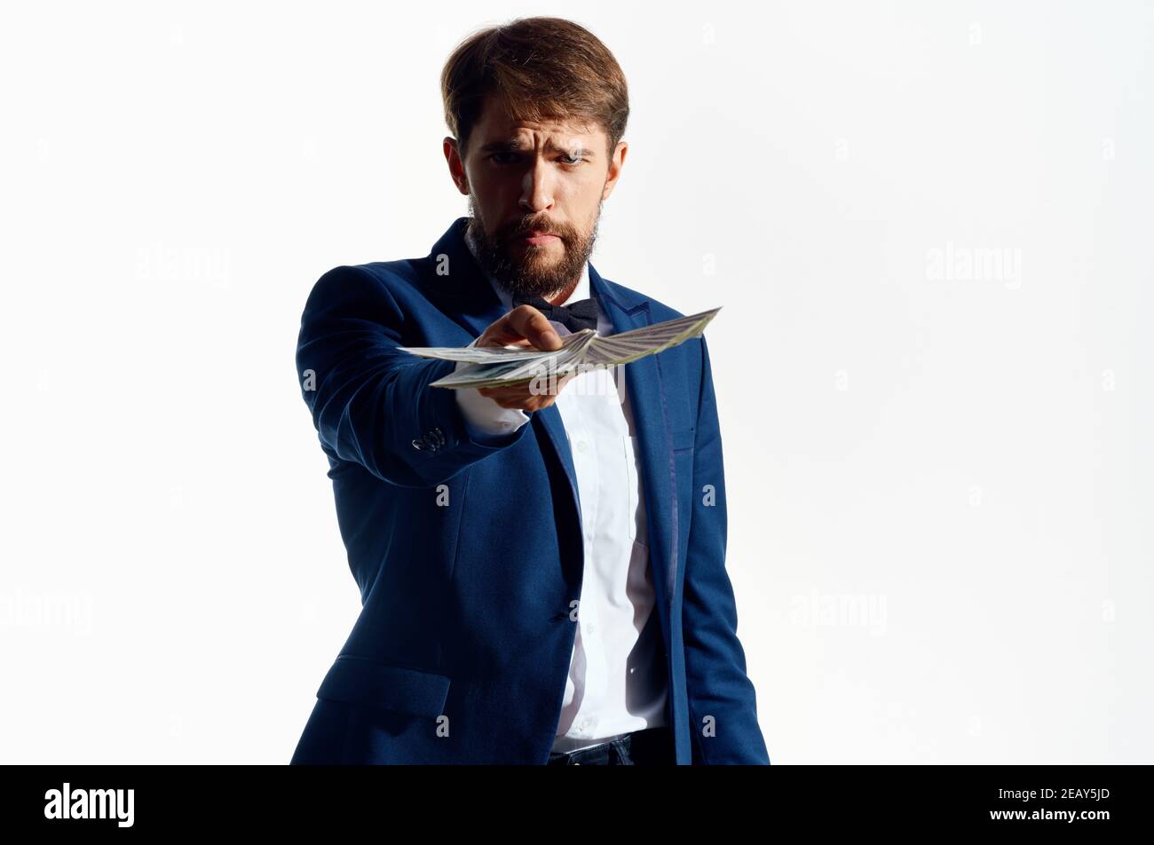 rich man with a bundle of money in his hand and a classic suit on a ...