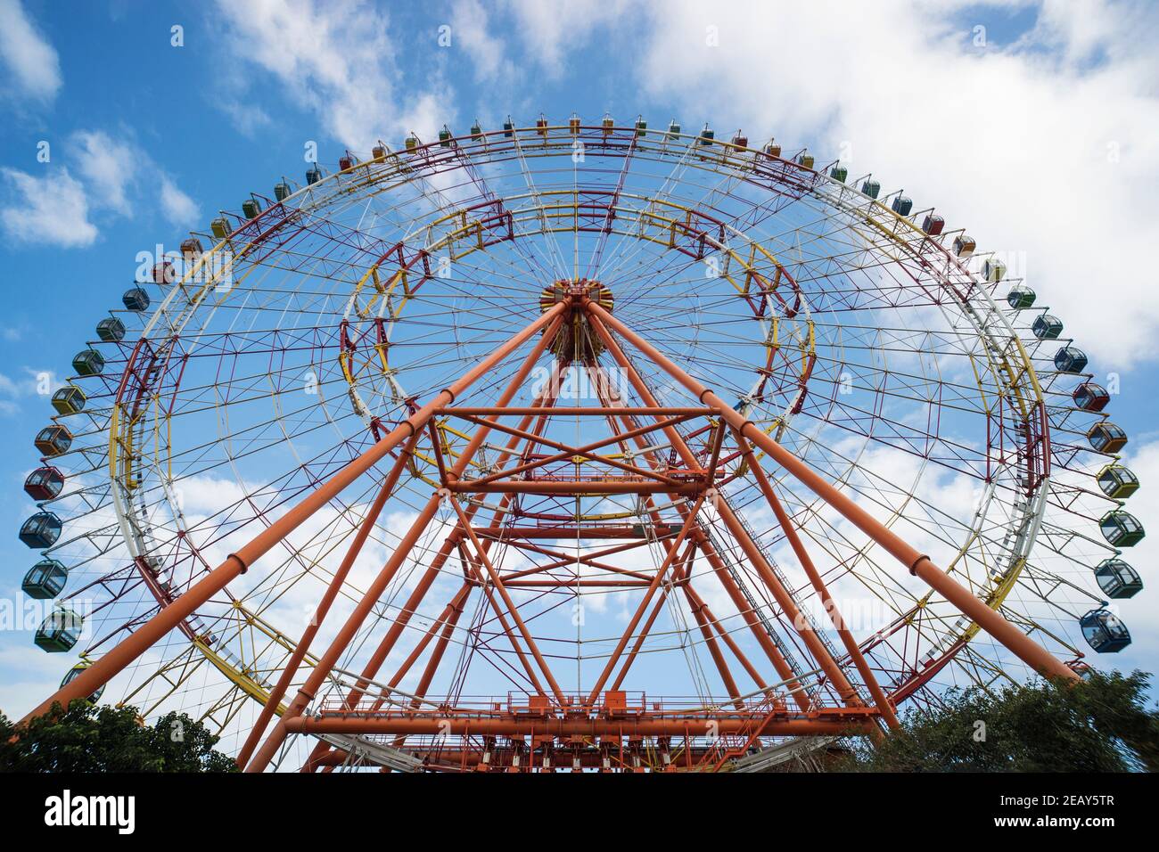 A colourful ferris wheel. Front view. bottom view of the high Ferris ...