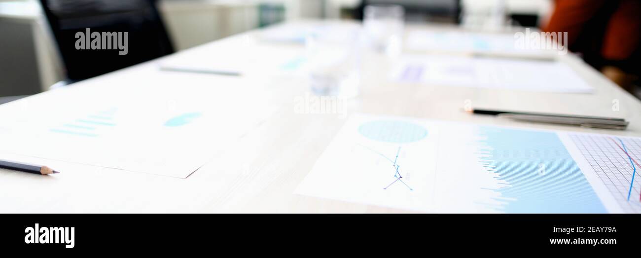 Desk in office with meeting documents Stock Photo - Alamy