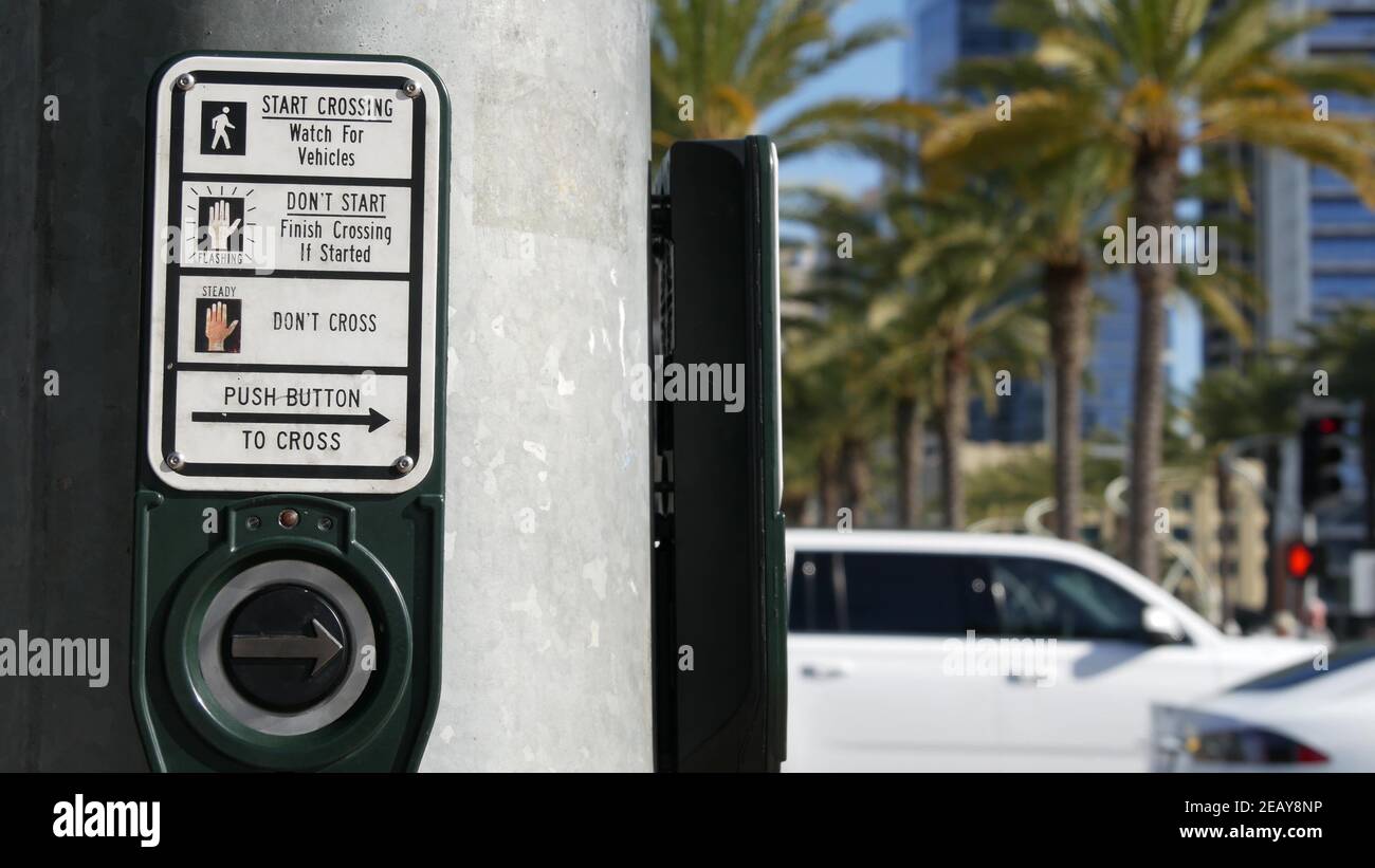 Traffic light button on pedestrian crosswalk, people have to push and ...