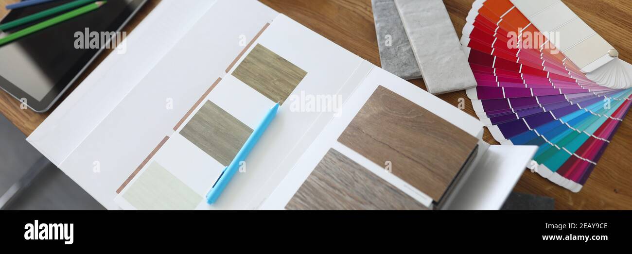 Samples of products with color palette lie on table Stock Photo - Alamy