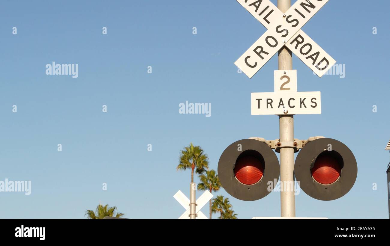 Level crossing warning signal in USA. Crossbuck notice and red traffic ...