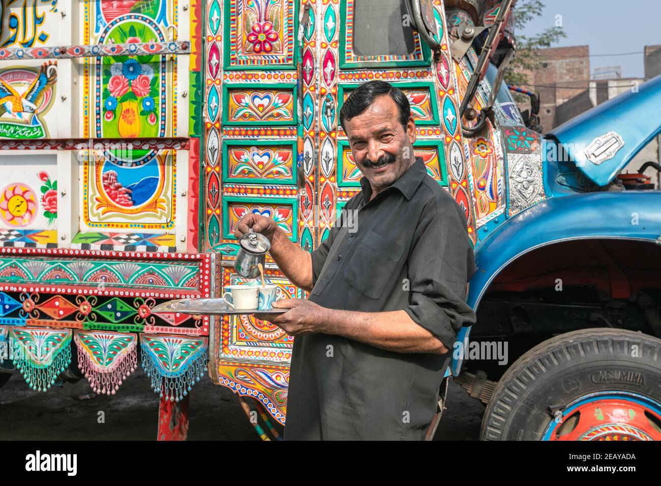 Lahore, Pakistan - October 2019: Man drinking tea near Pakistani ...