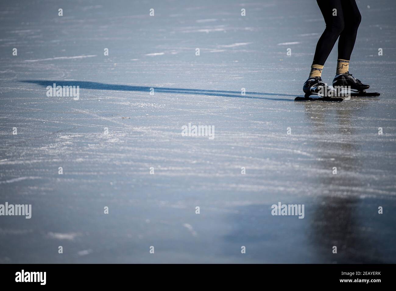 Illustration shows people skating at natural ice at a frozen flood ...