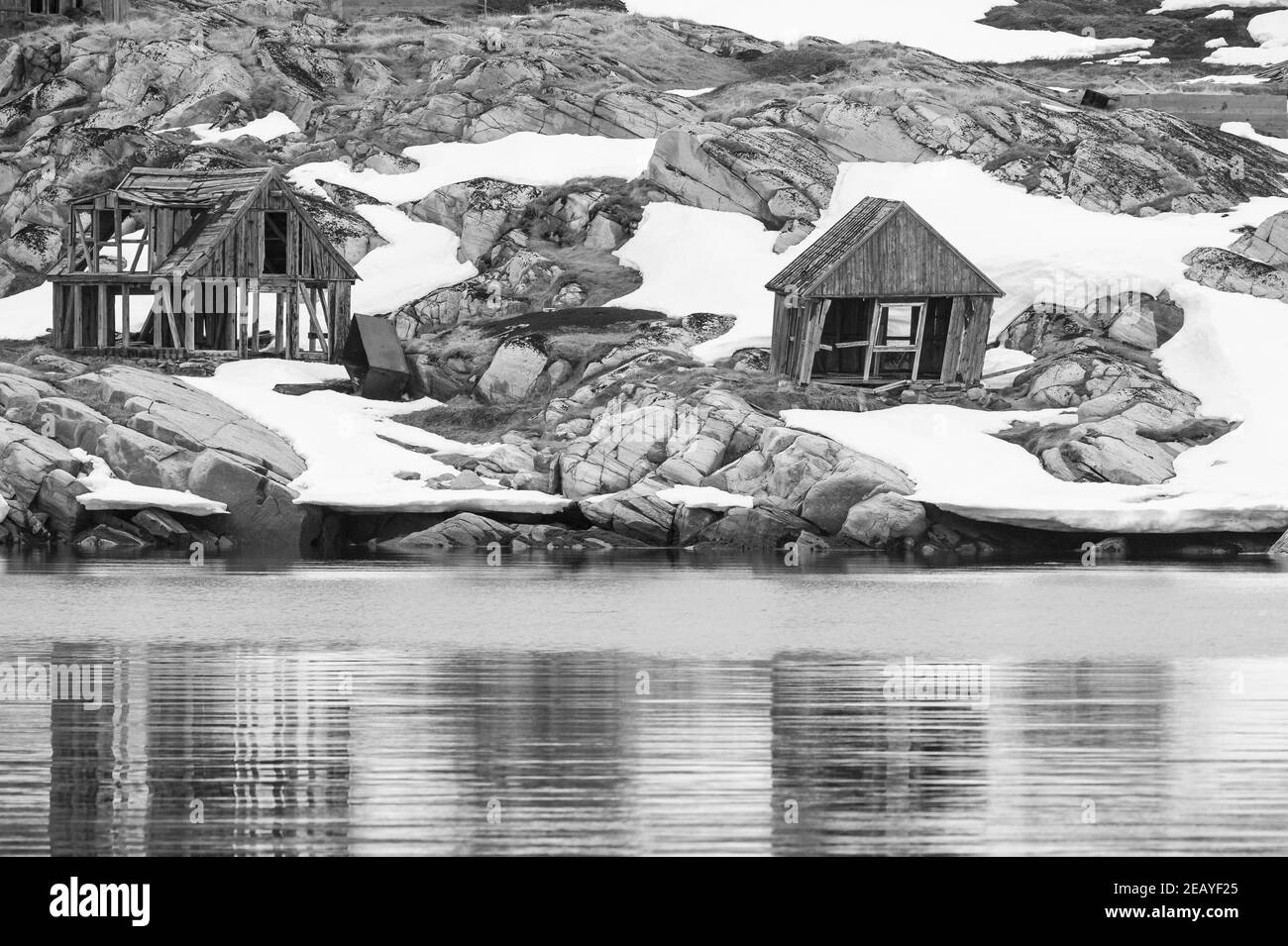 Greyscale shot of an abandoned village, on an island at Disko Bay ...