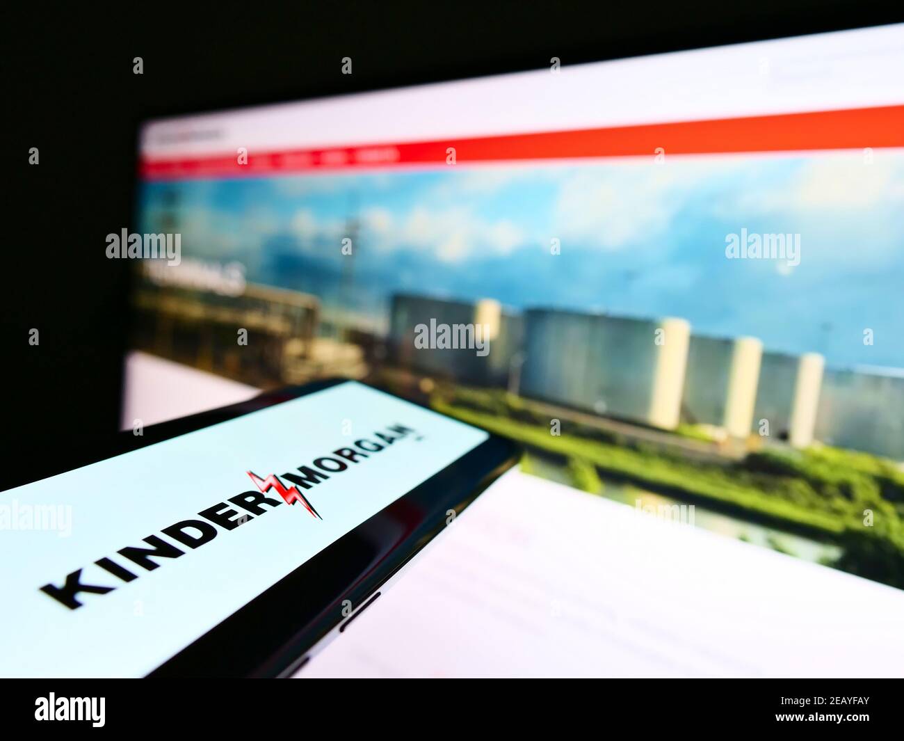 Mobile phone with logo of US energy infrastructure company Kinder ...