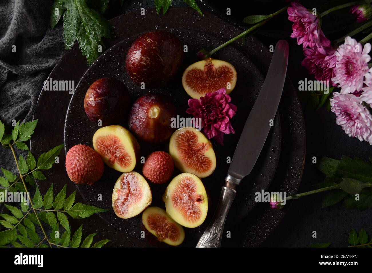 Raw fresh fig fruits on dark background. Slices of fresh common fig ...