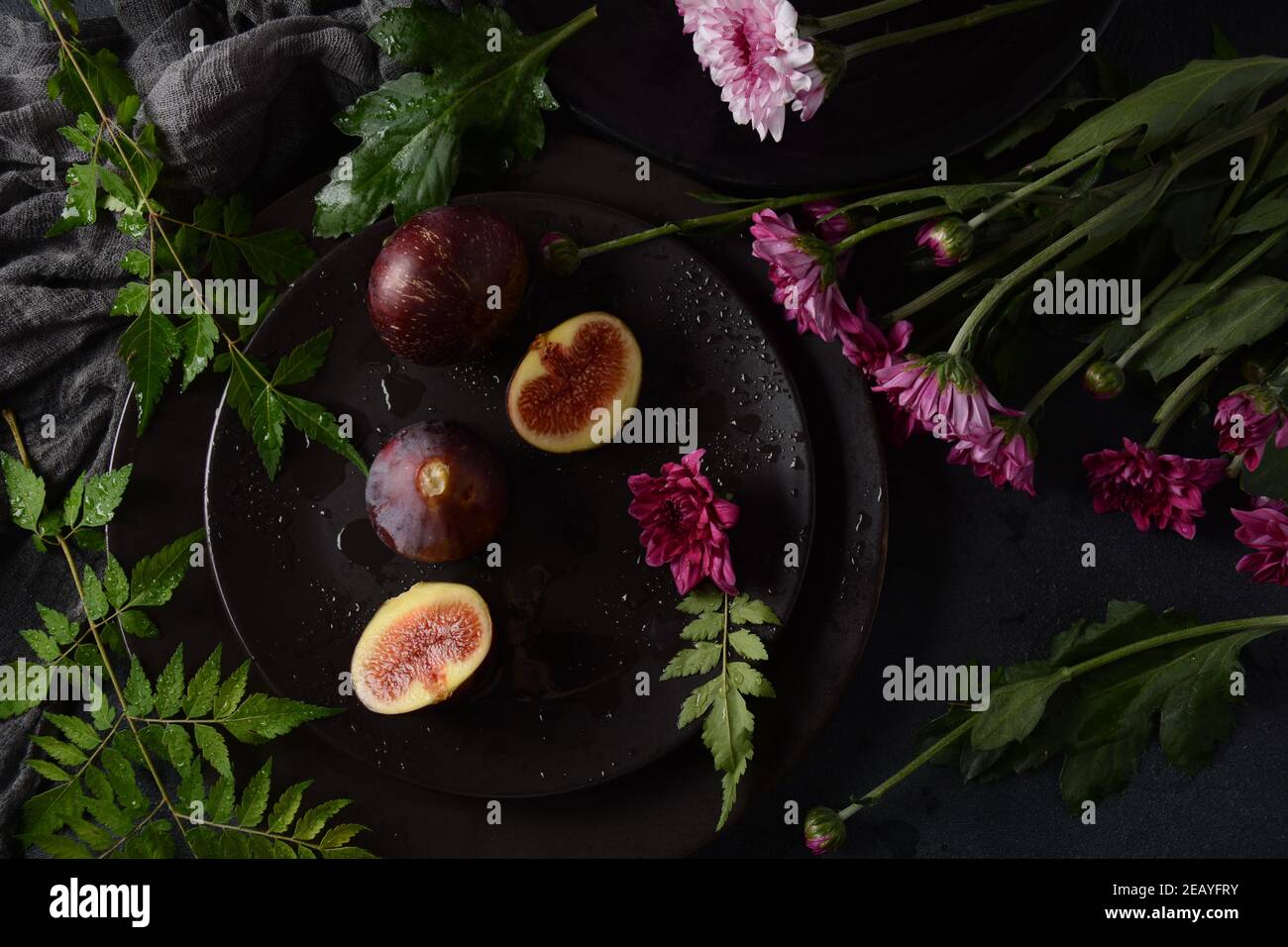 Raw fresh fig fruits on dark background. Slices of fresh common fig ...
