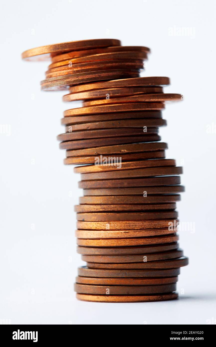 Picture of unstable stock of coins Stock Photo - Alamy