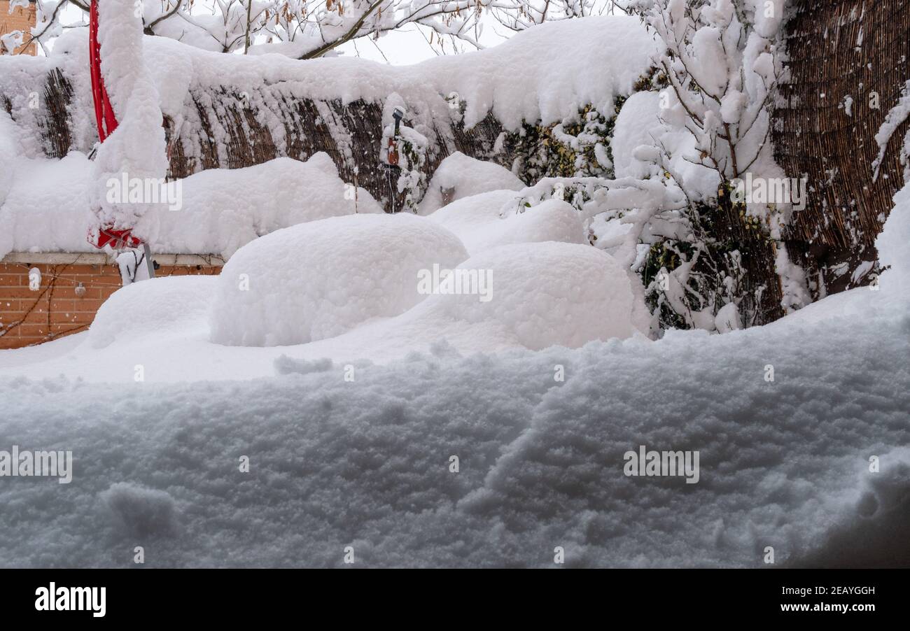 Beautiful view of a backyard covered in thick snow in winter Stock ...