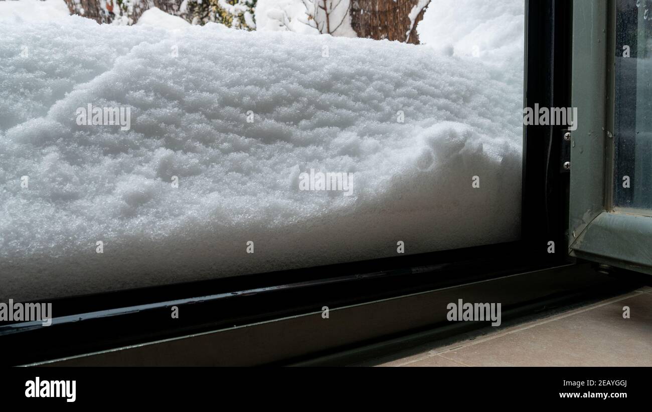 Snowfall outside the window hi-res stock photography and images - Alamy
