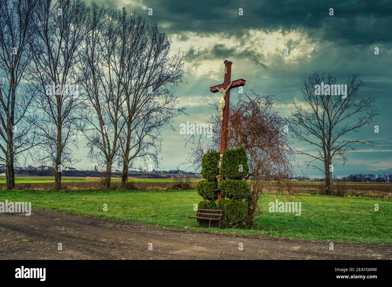 Roadside cross in the countryside on a gloomy day, characteristic of ...