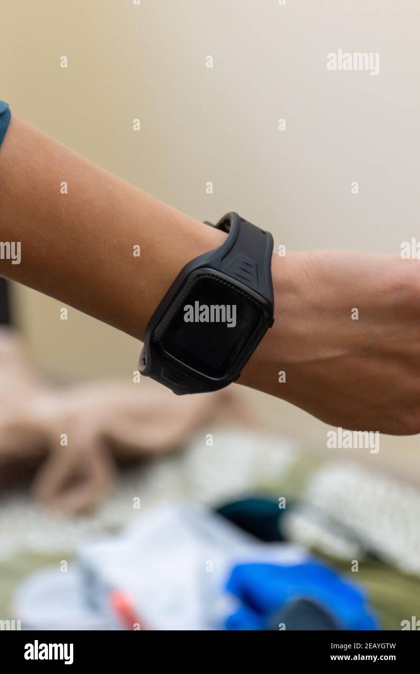 Portrait view of A COVID-19 positive tracking watch smart device for ...