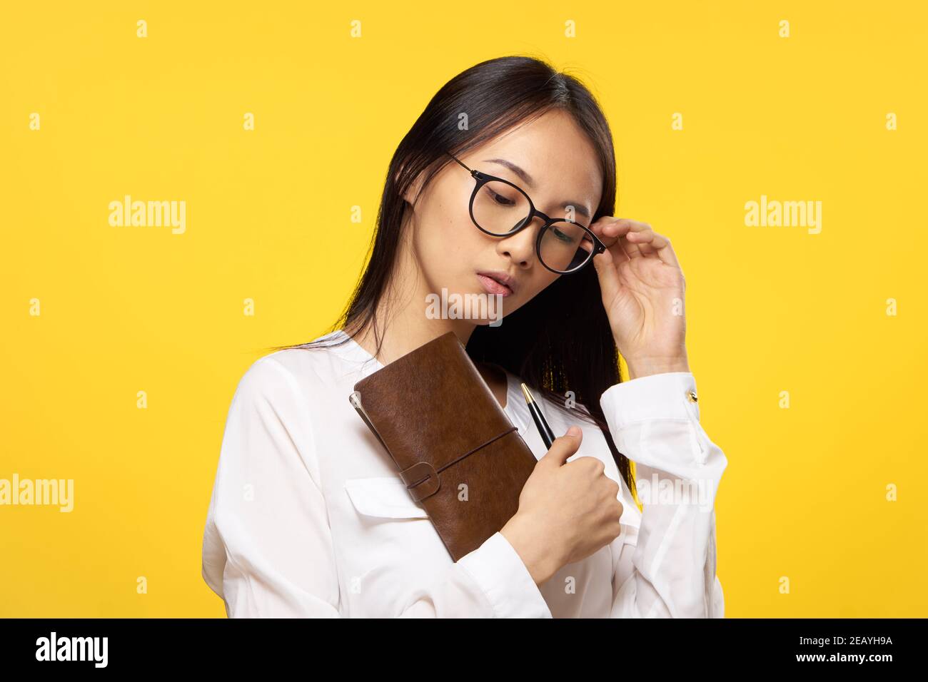 women with glasses notepad in the hands of an official office lifestyle ...