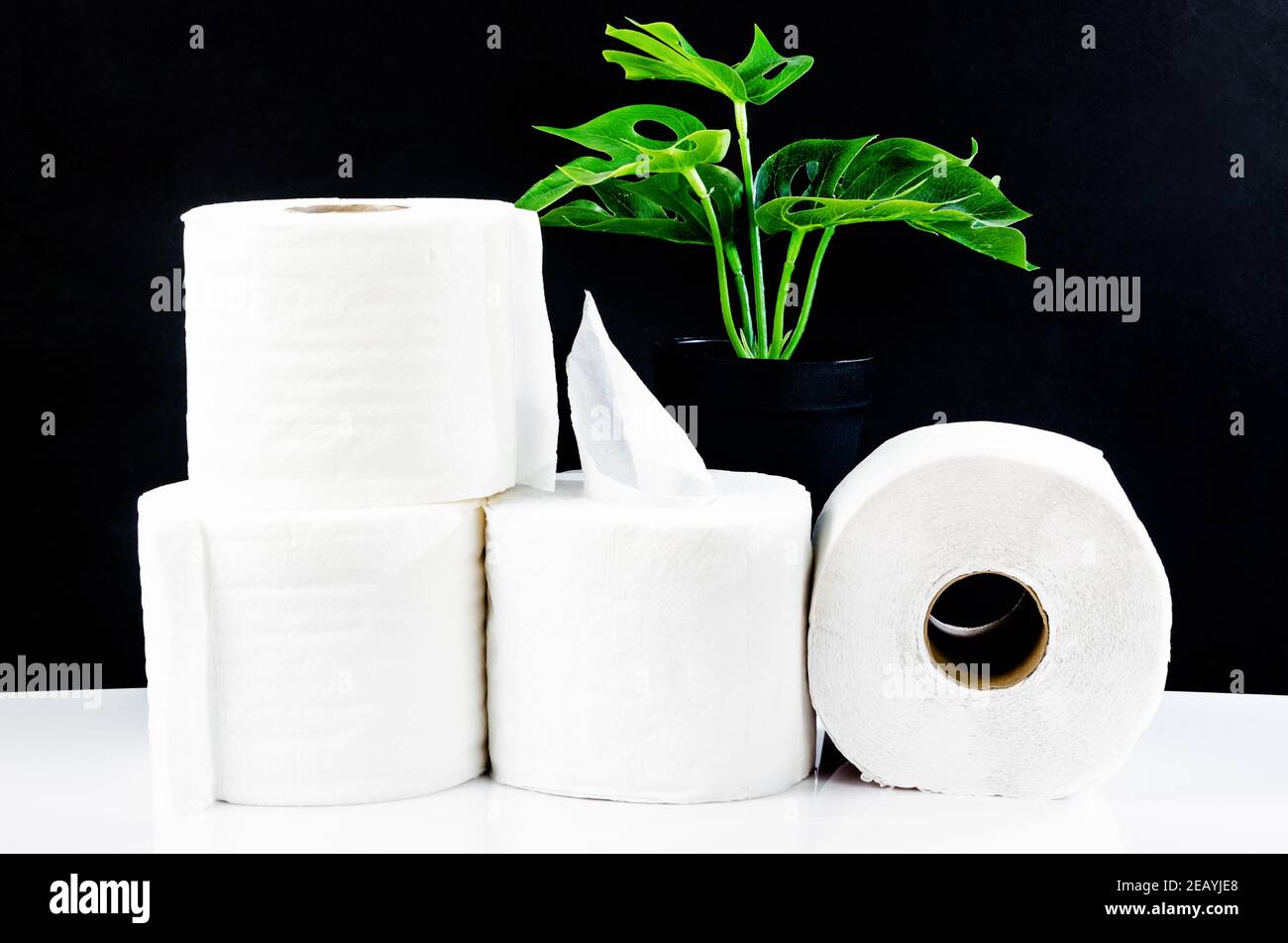 Tissue paper rolls on the black background Stock Photo - Alamy
