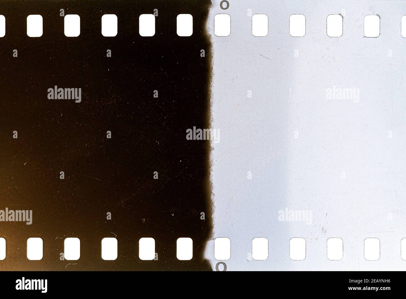 Dusty and grungy 35mm film texture or surface. Perforated camera film ...