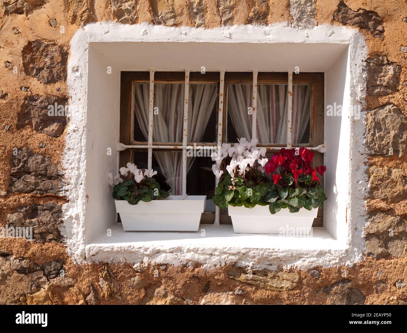 Window and flower boxes seen from the street in the hill-top town of ...