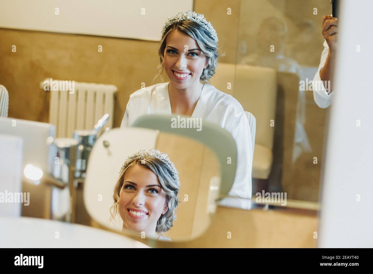 Bride being made up before the wedding with multiple mirrors Stock ...