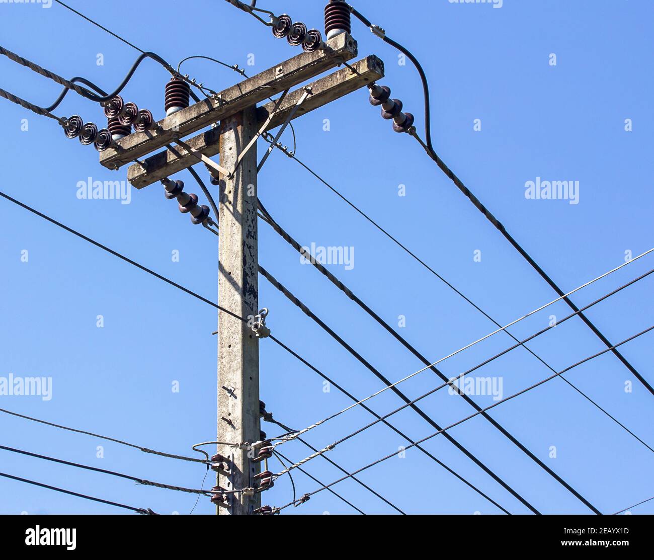Electrical pole with power line cables and blue sky background Stock ...