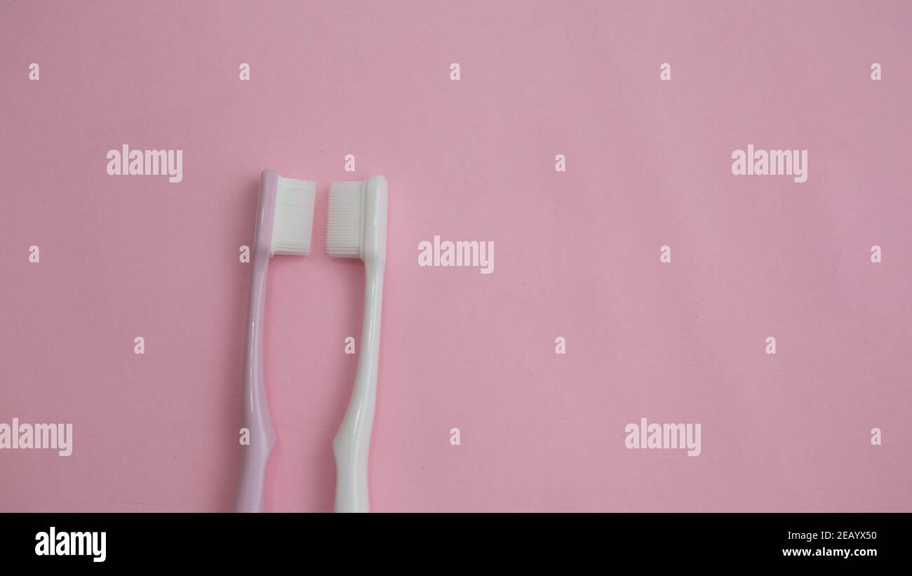 New toothbrushes of a pink surface with a copy space on the right Stock ...
