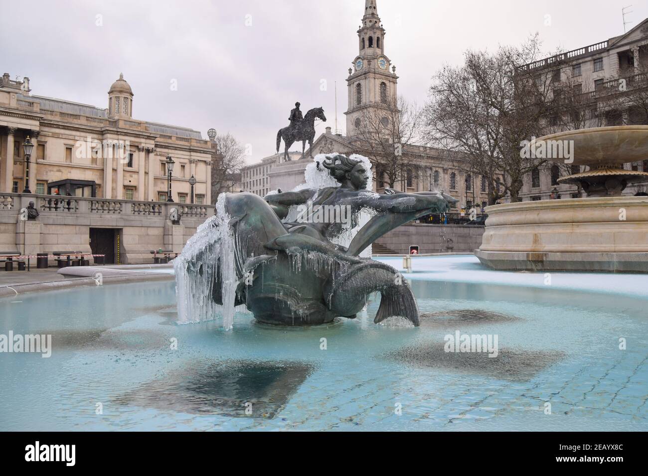 Frozen fountain statue at Trafalgar Square, London, UK 11 February 2021 ...