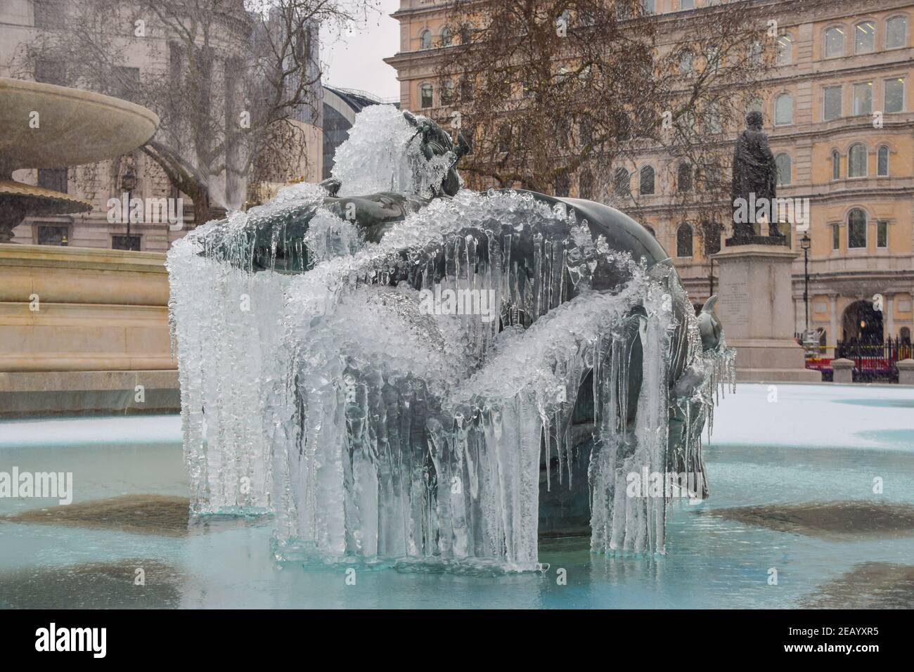 Frozen fountain statue at Trafalgar Square, London, UK 11 February 2021 ...