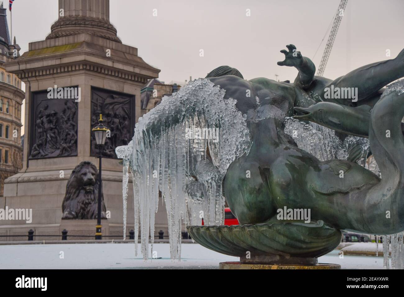 Frozen fountain statue at Trafalgar Square, London, UK 11 February 2021 ...