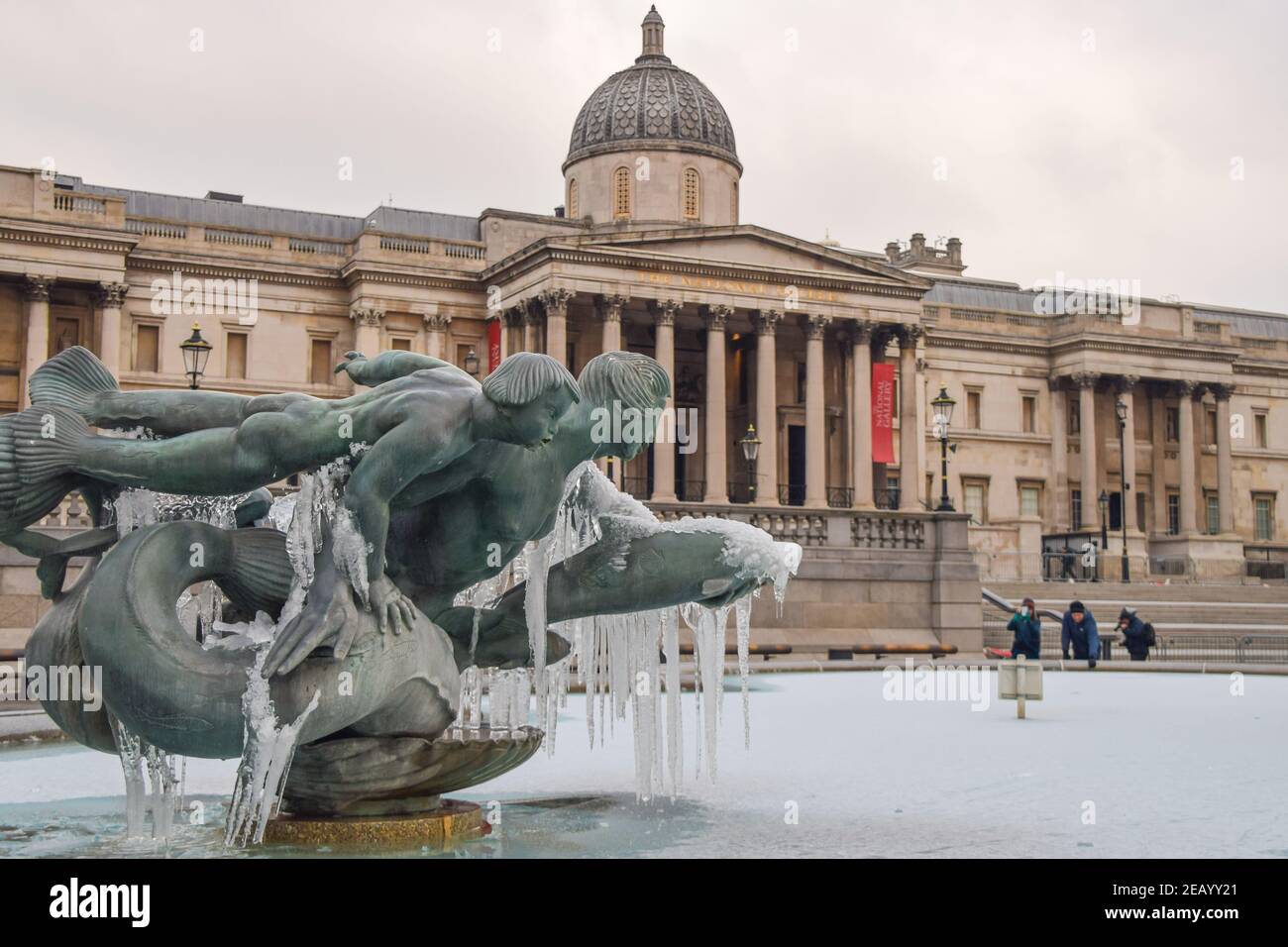 Frozen fountain statue at Trafalgar Square, London, UK 11 February 2021 ...