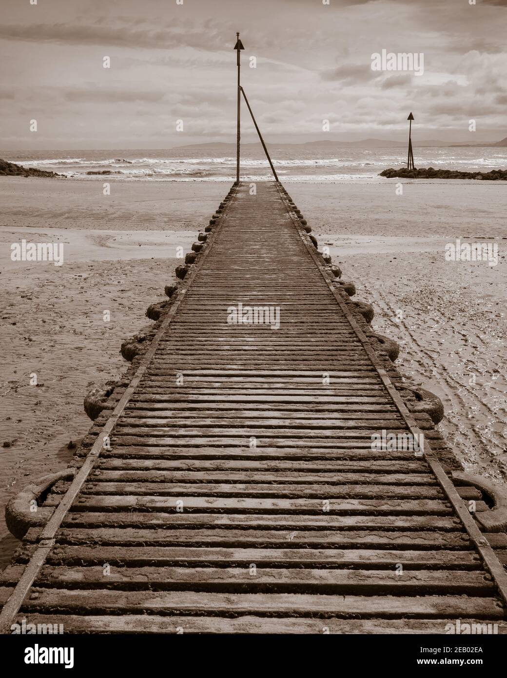 Wooden slipway at the seaside resort of Rhos on Sea in North Wales ...