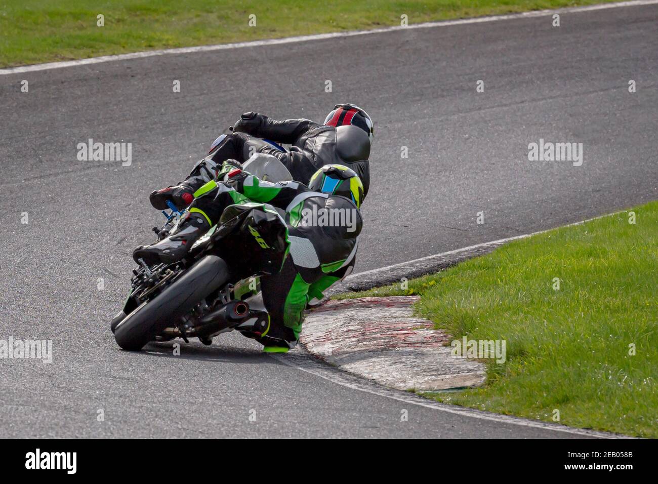 A shot of a racing motorbike as it circuits a track Stock Photo - Alamy
